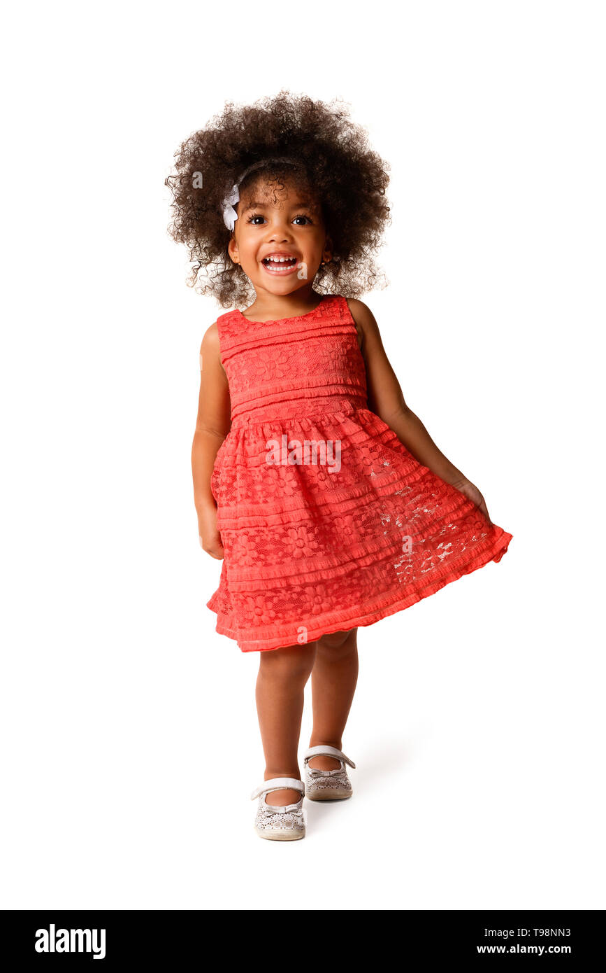 Full length portrait of cheerful african american little girl in dress ...