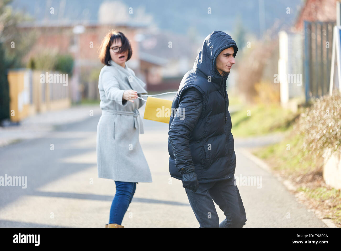 Man robbing woman hi-res stock photography and images - Alamy