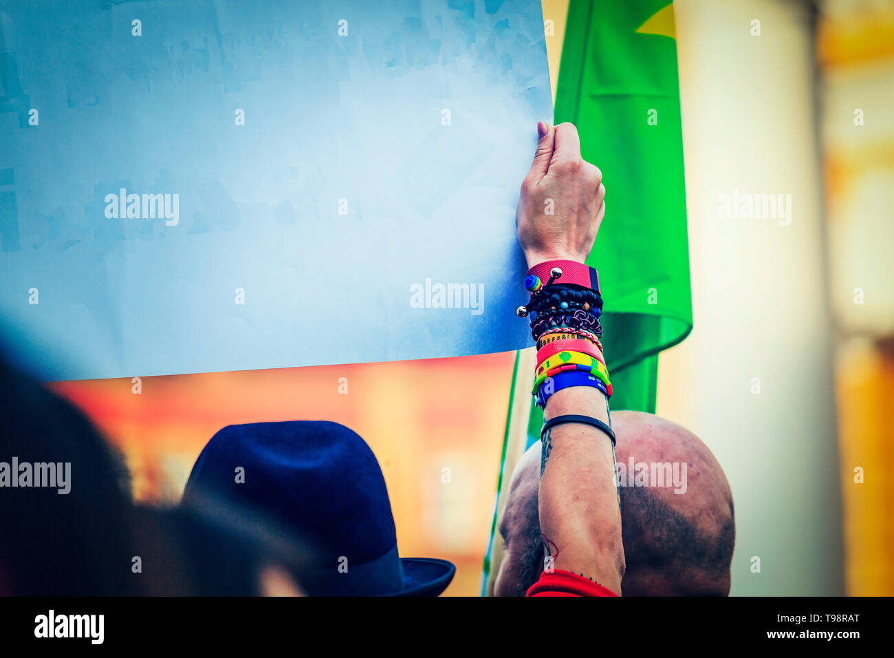 Pride. A hand with LGBT symbols and holding a poster. Rainbow bandage ...
