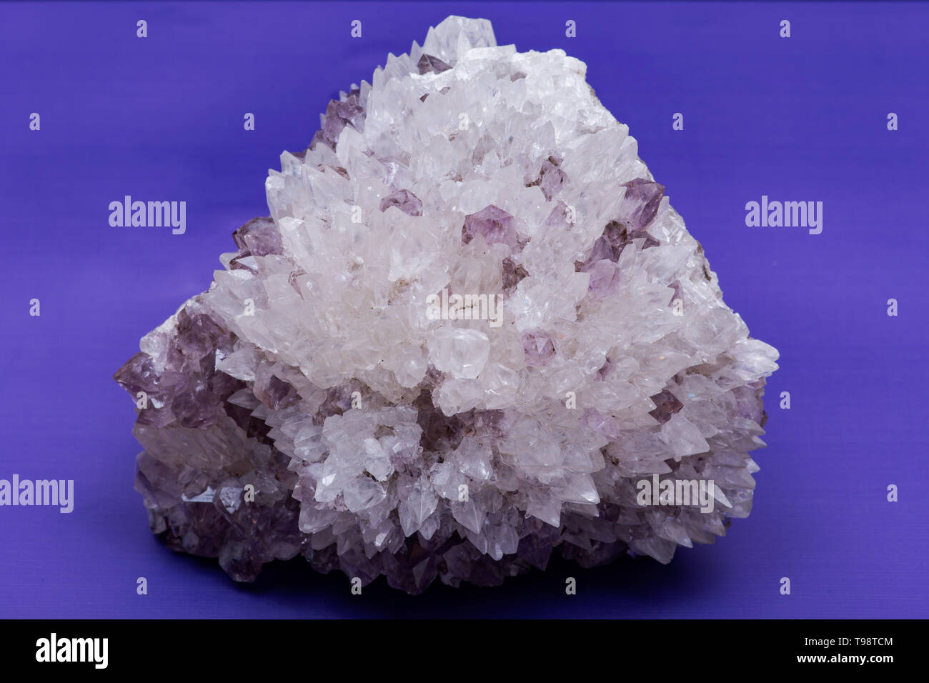 Needle Quartz With Amethyst Specimen on purple background Stock Photo ...