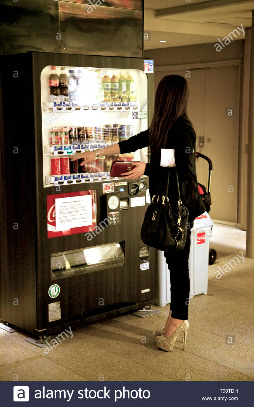 Woman Vending Machine Food Stock Photos & Woman Vending Machine Food ...