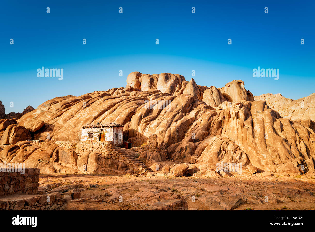Egyptian mountains and old small hut with bly sky. Holly land of Egypt ...