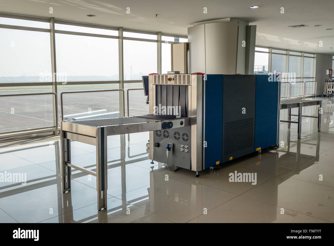 X-ray scanner baggage and metal detectors with conveyor belt in the ...