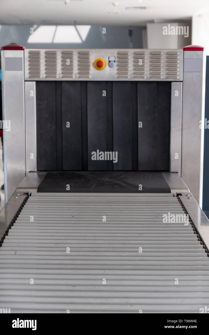 X-ray scanner baggage and metal detectors with conveyor belt in the ...