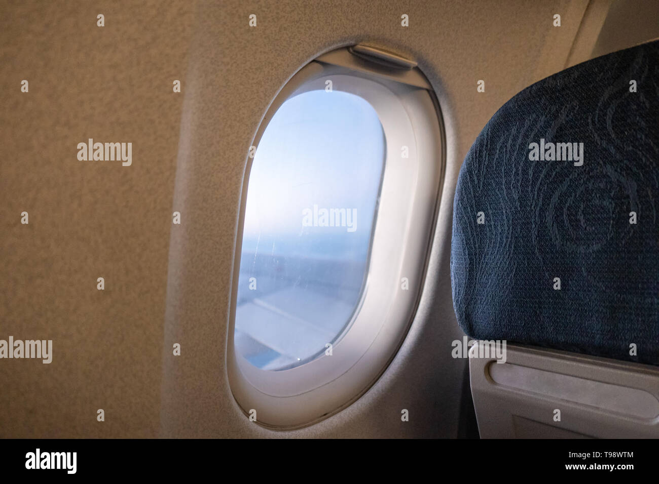 Window side of passenger with wing airplane flying on sky Stock Photo ...