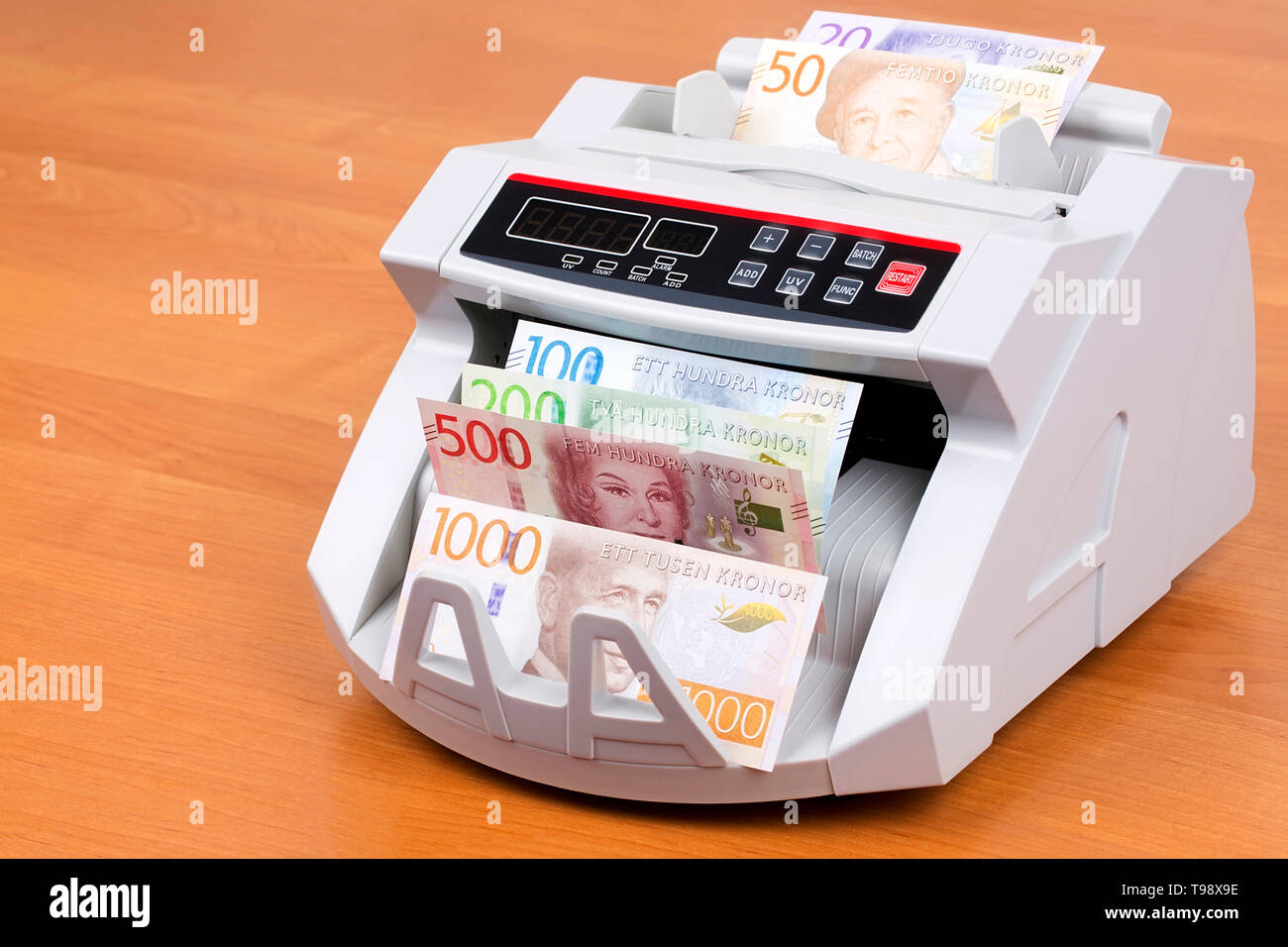 Swedish money in a counting machine Stock Photo - Alamy