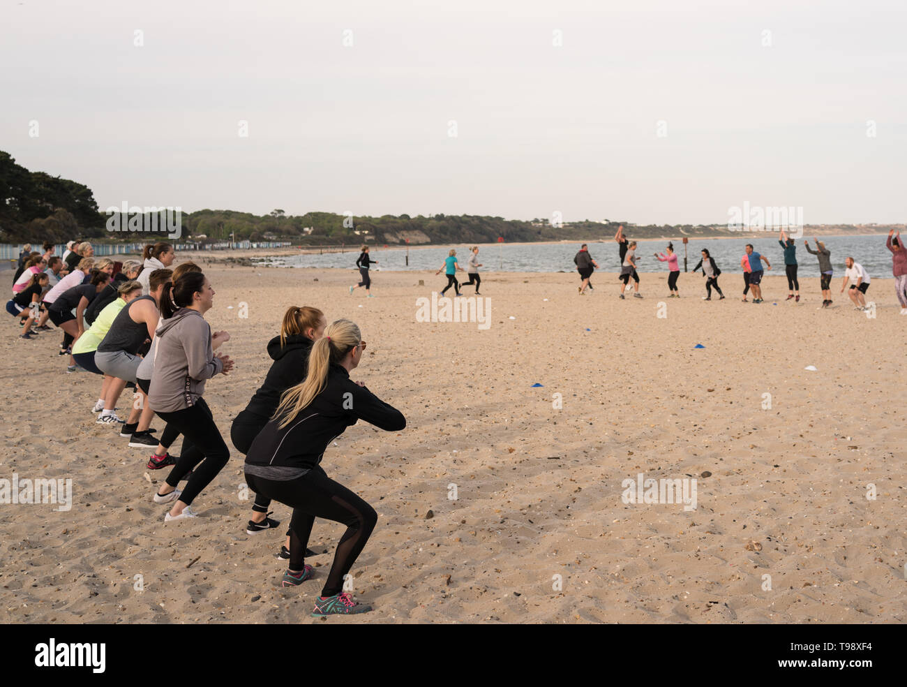 Group exercise on beach hi-res stock photography and images - Alamy