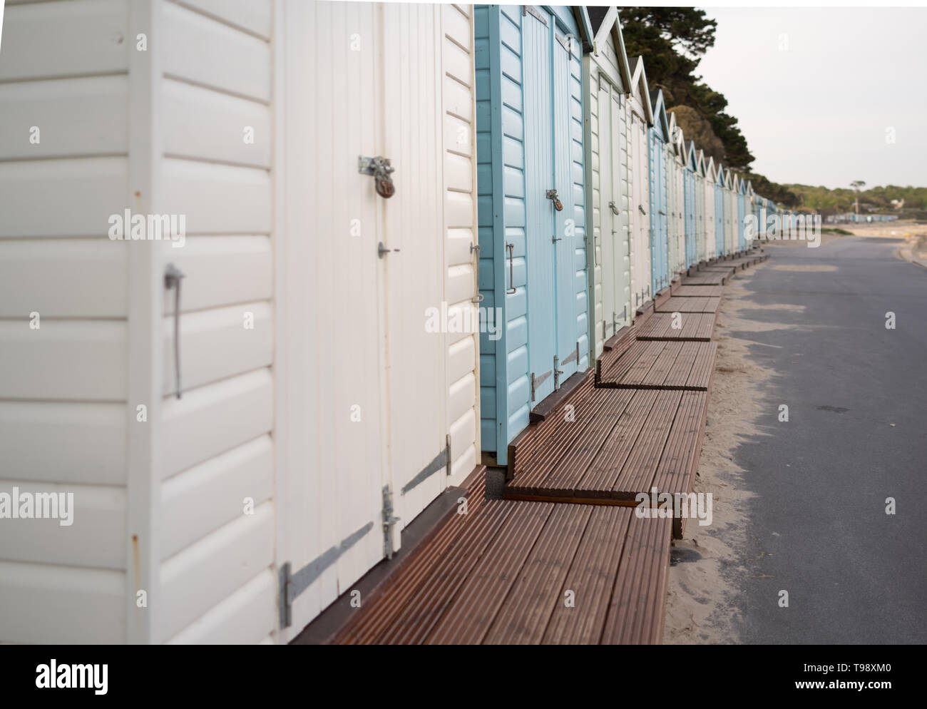 Beach huts at Avon Beach Mudeford stretching into distance Stock Photo ...