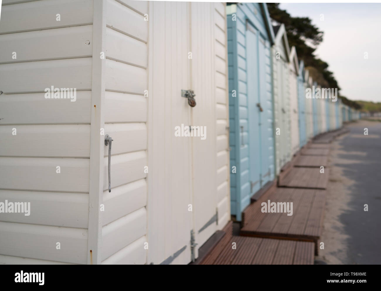 Beach huts at Avon Beach Mudeford near Bournemouth stretching into ...