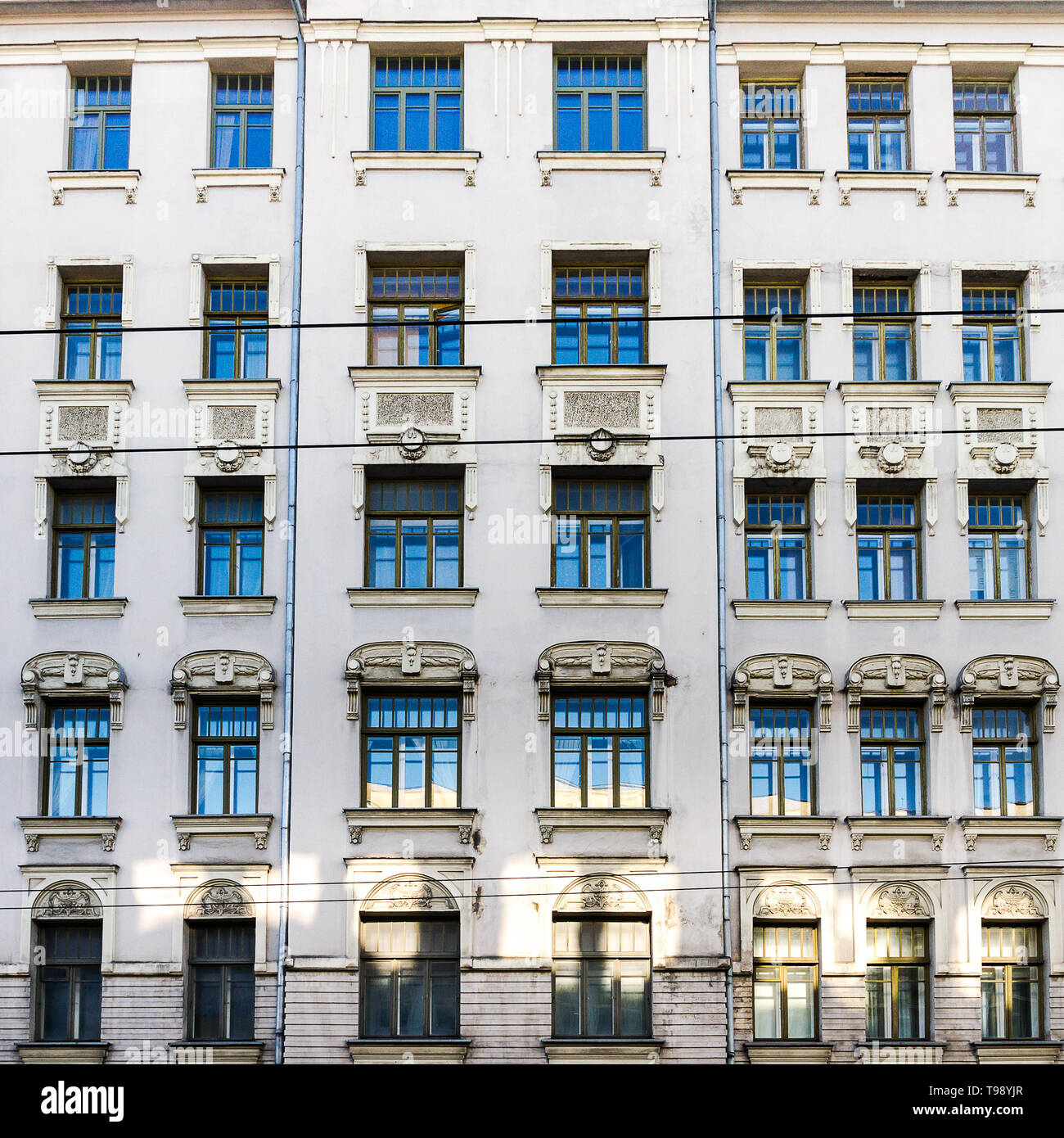 Close up of white wall with lots of windows. Architectural background ...