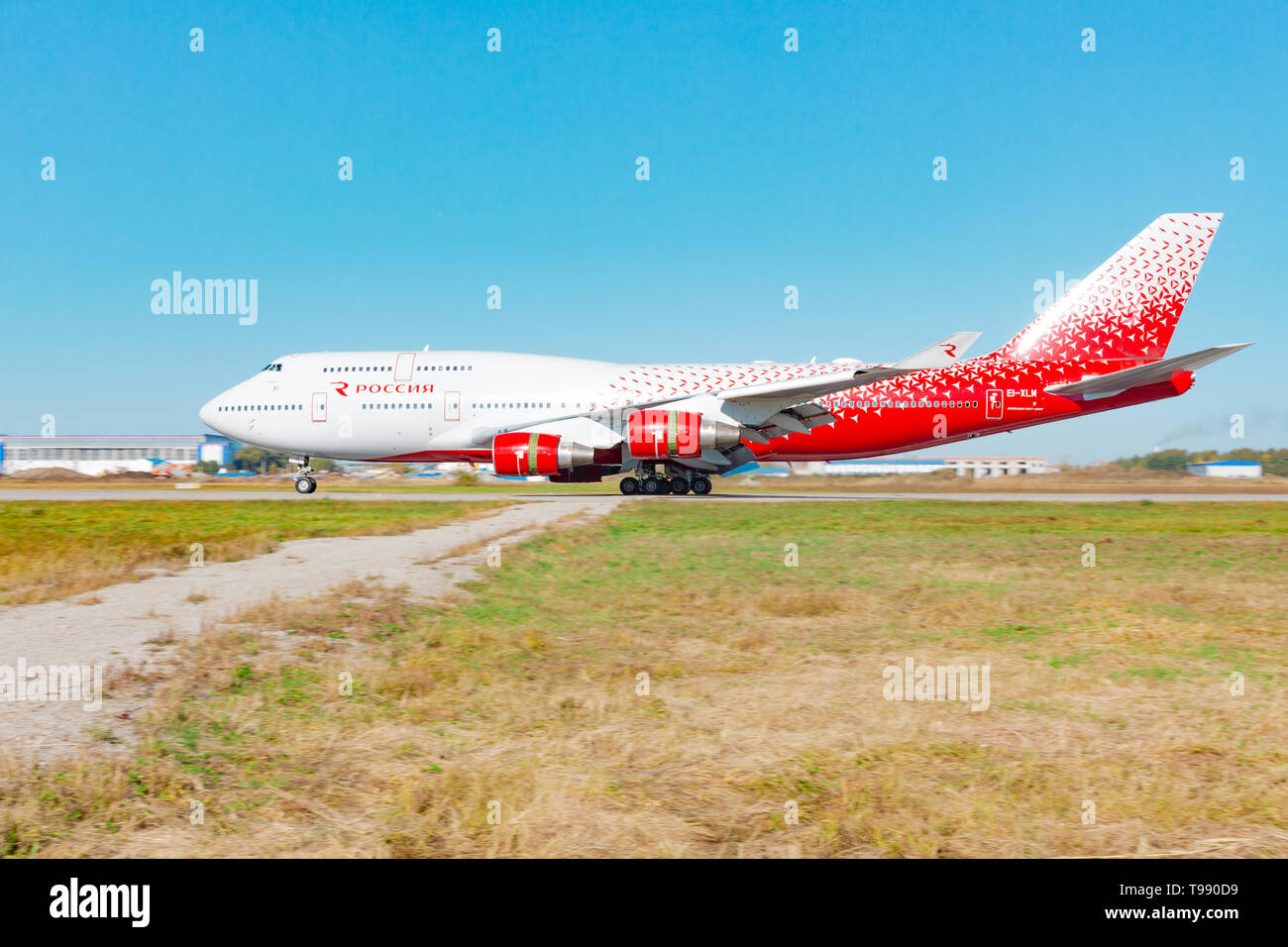 The plane lands on the runway at sunrise at high speed. Airport ...