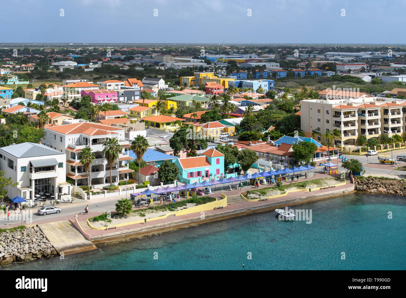 Aerial view of the waterfront coastal tropical city with bright houses ...
