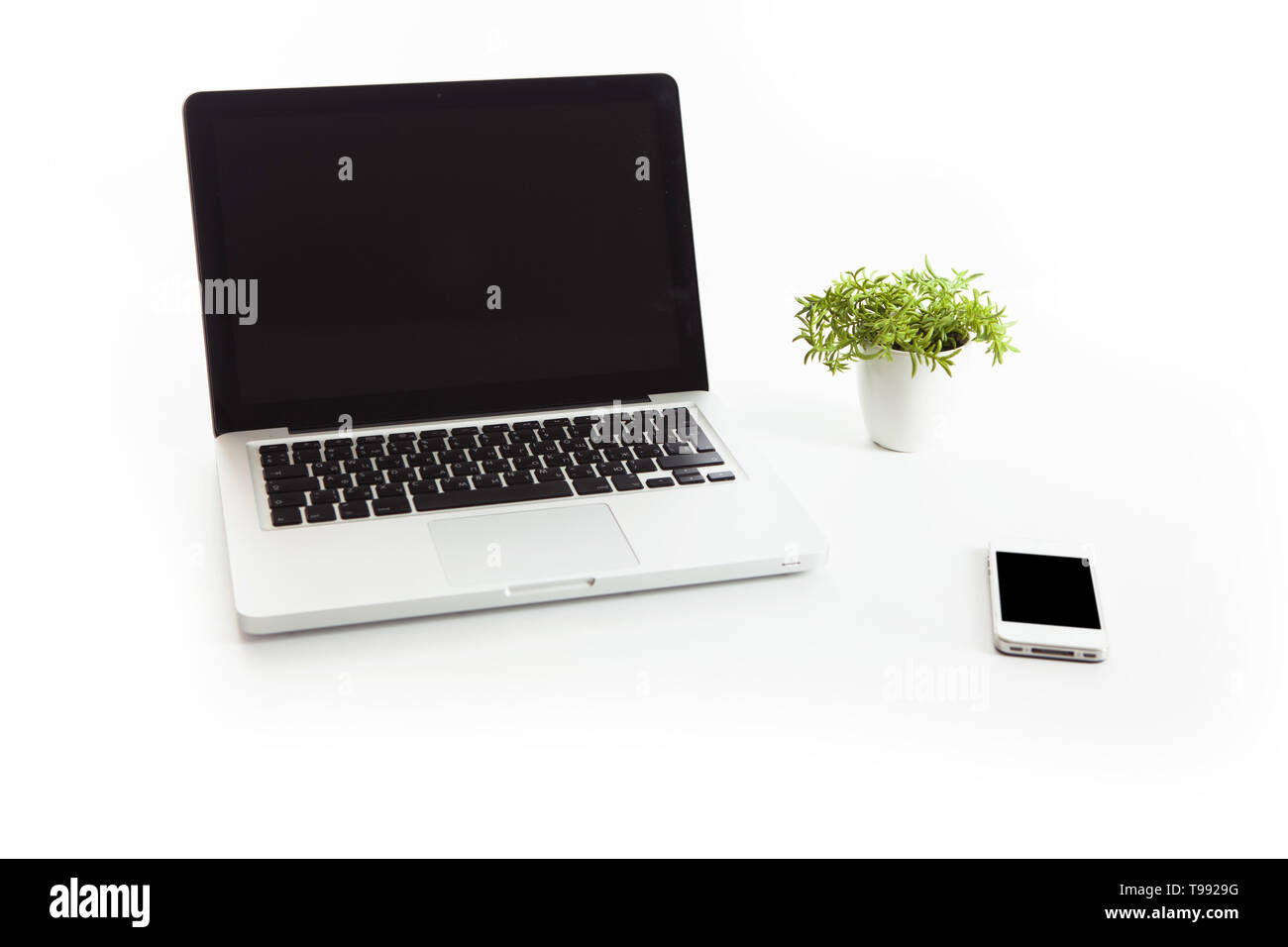 Man hand on laptop keyboard with blank screen monitor Stock Photo - Alamy