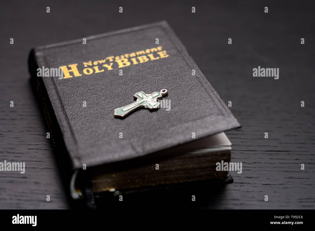 The Bible Opened. The holy bible close up and the cross Stock Photo - Alamy