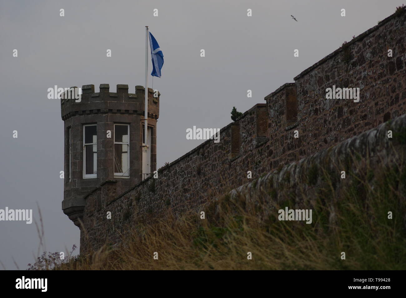 Crail Castle Wall and Lookout Tower with the Scottish Saltire on a ...