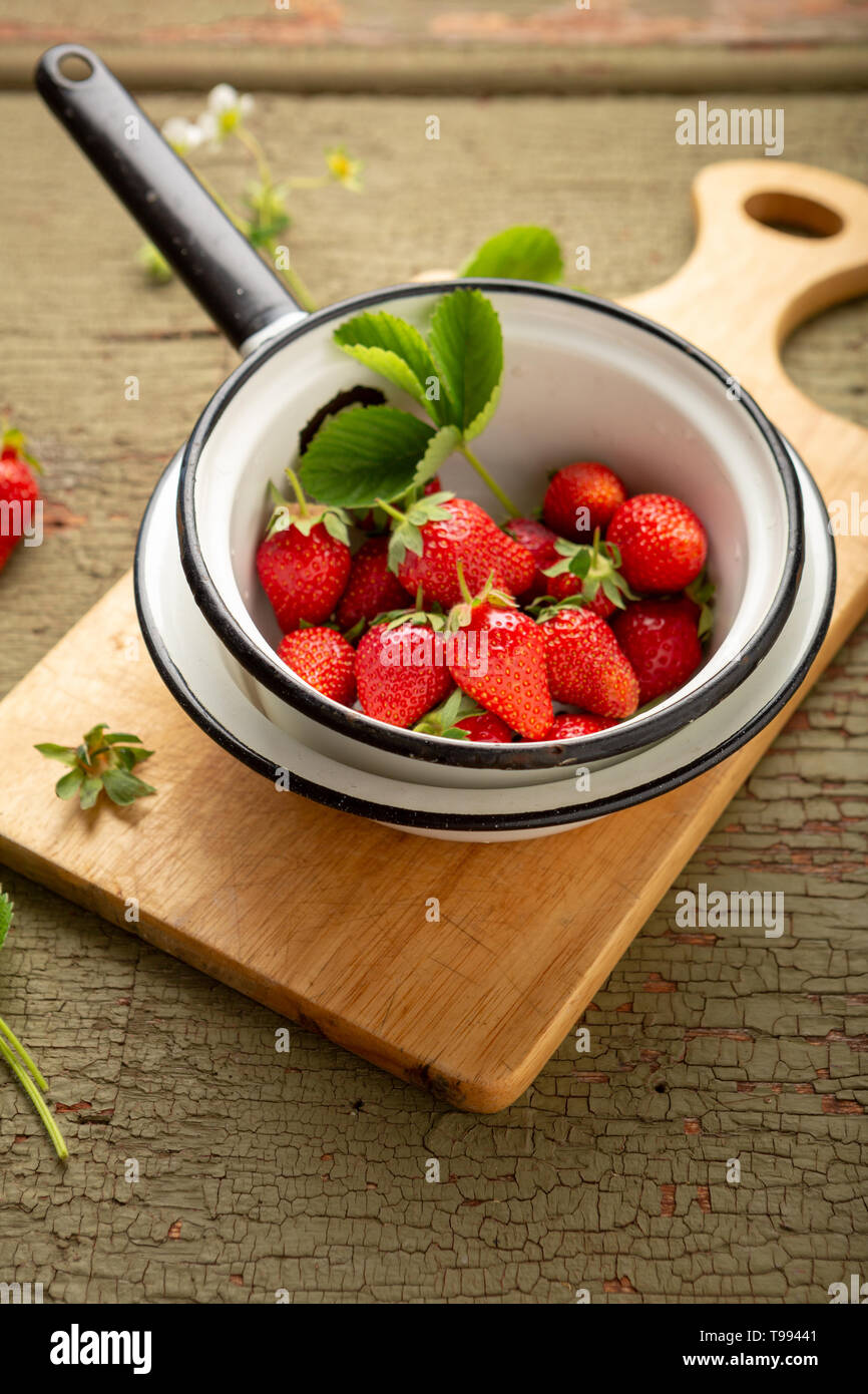 Red strawberry in white colander Stock Photo - Alamy