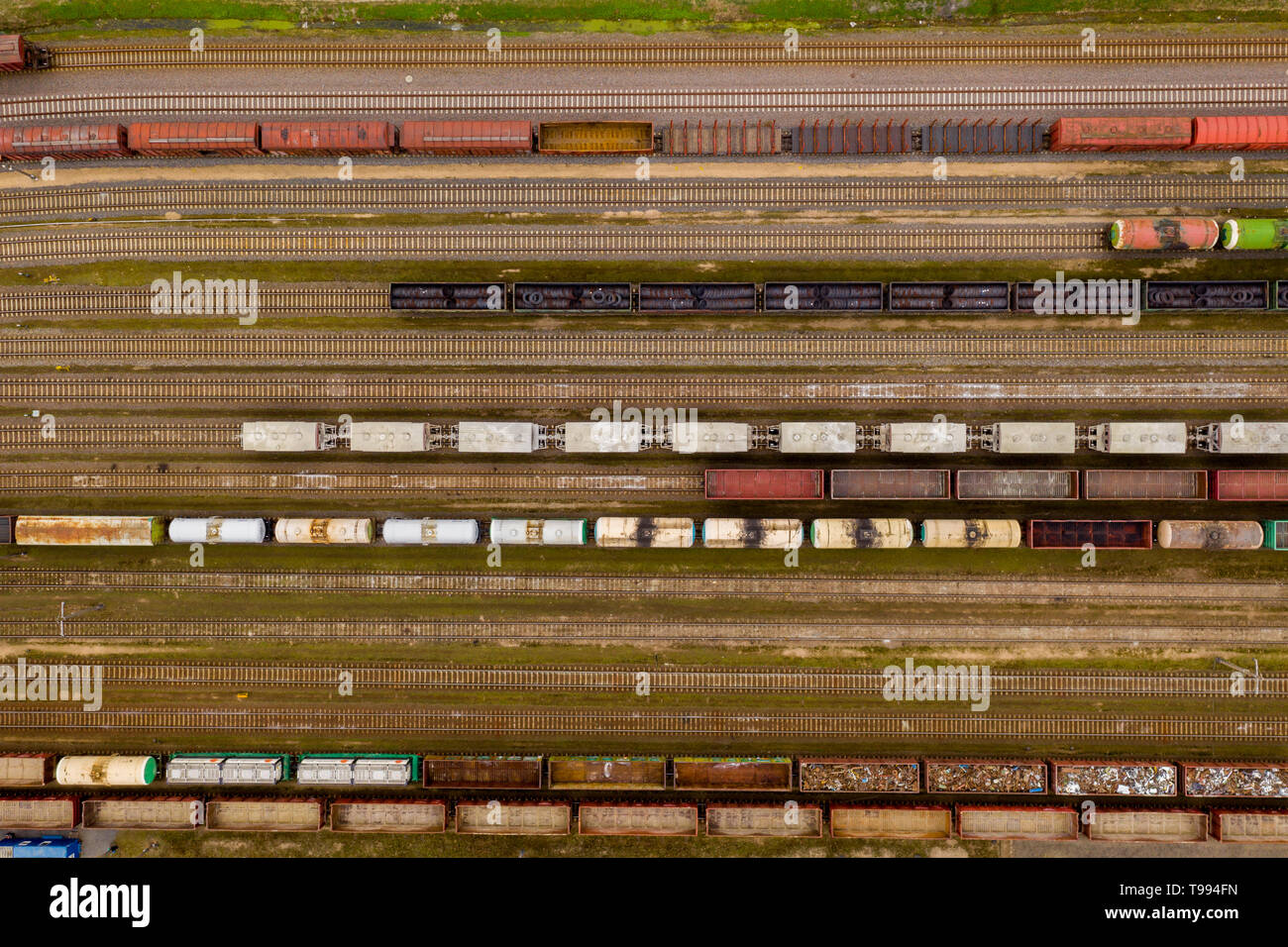 Aerial view of colorful freight trains with goods on the railway ...