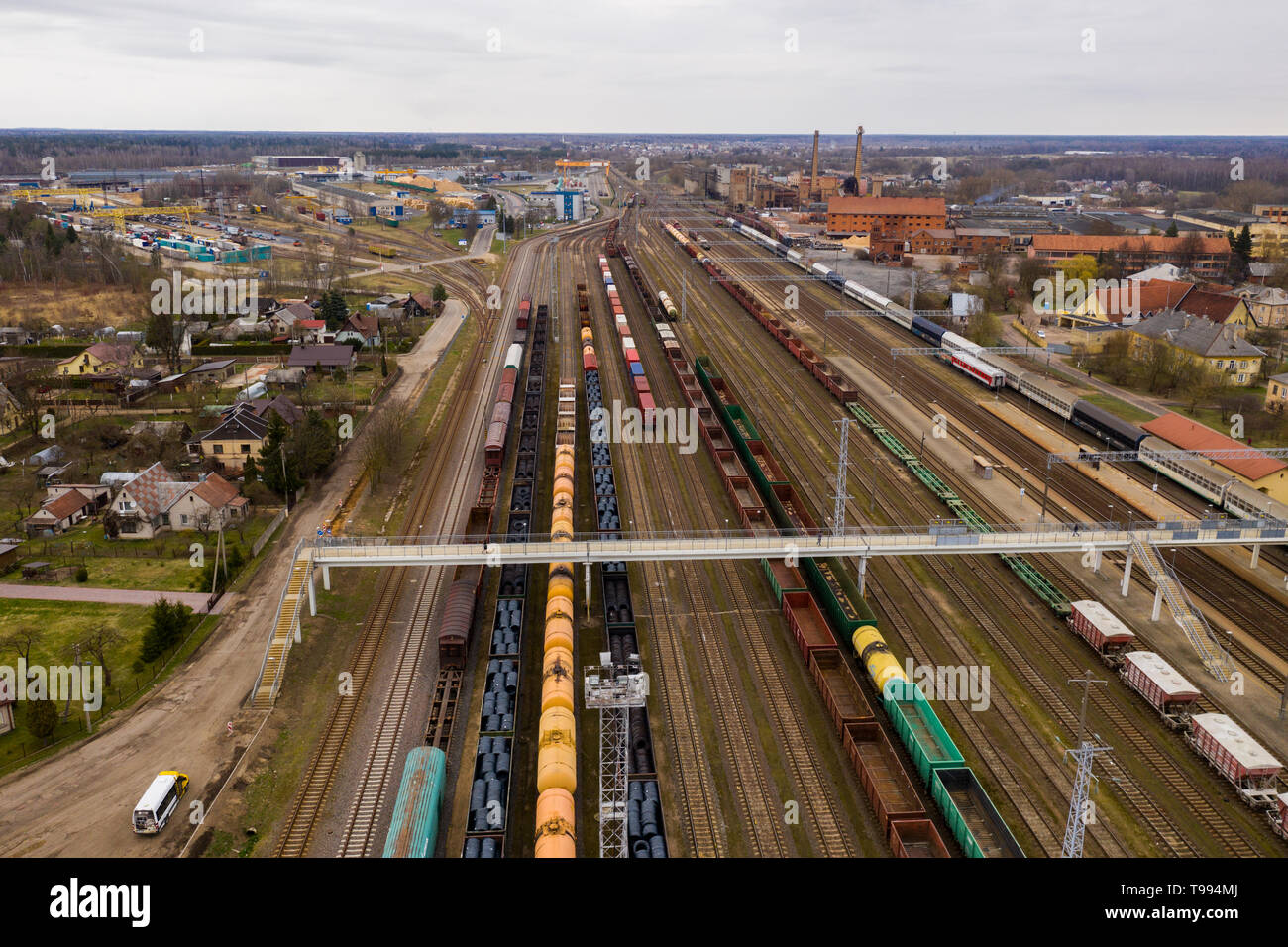 Aerial view of colorful freight trains with goods on the railway ...