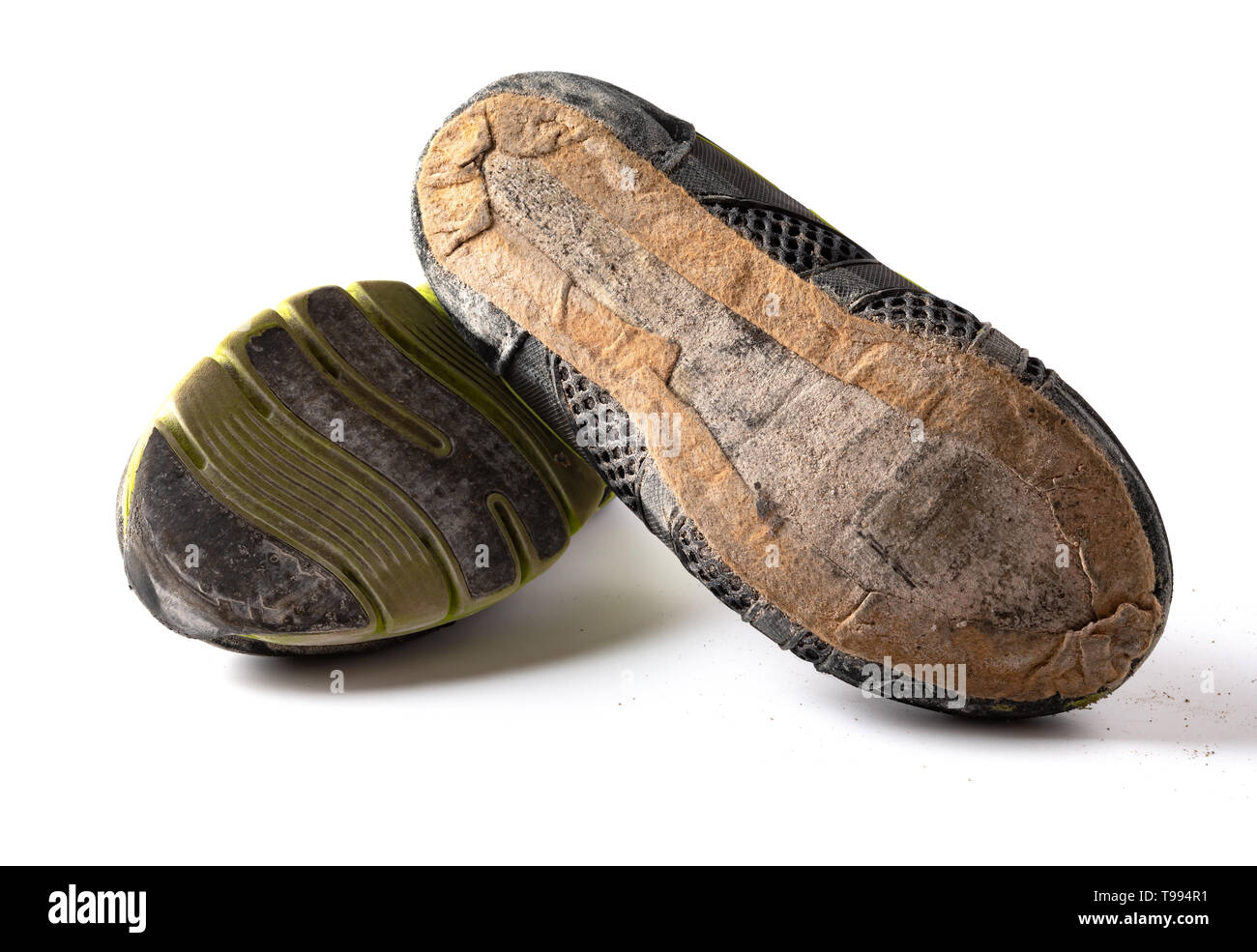 pair of broken sporty shoes on white background Stock Photo - Alamy