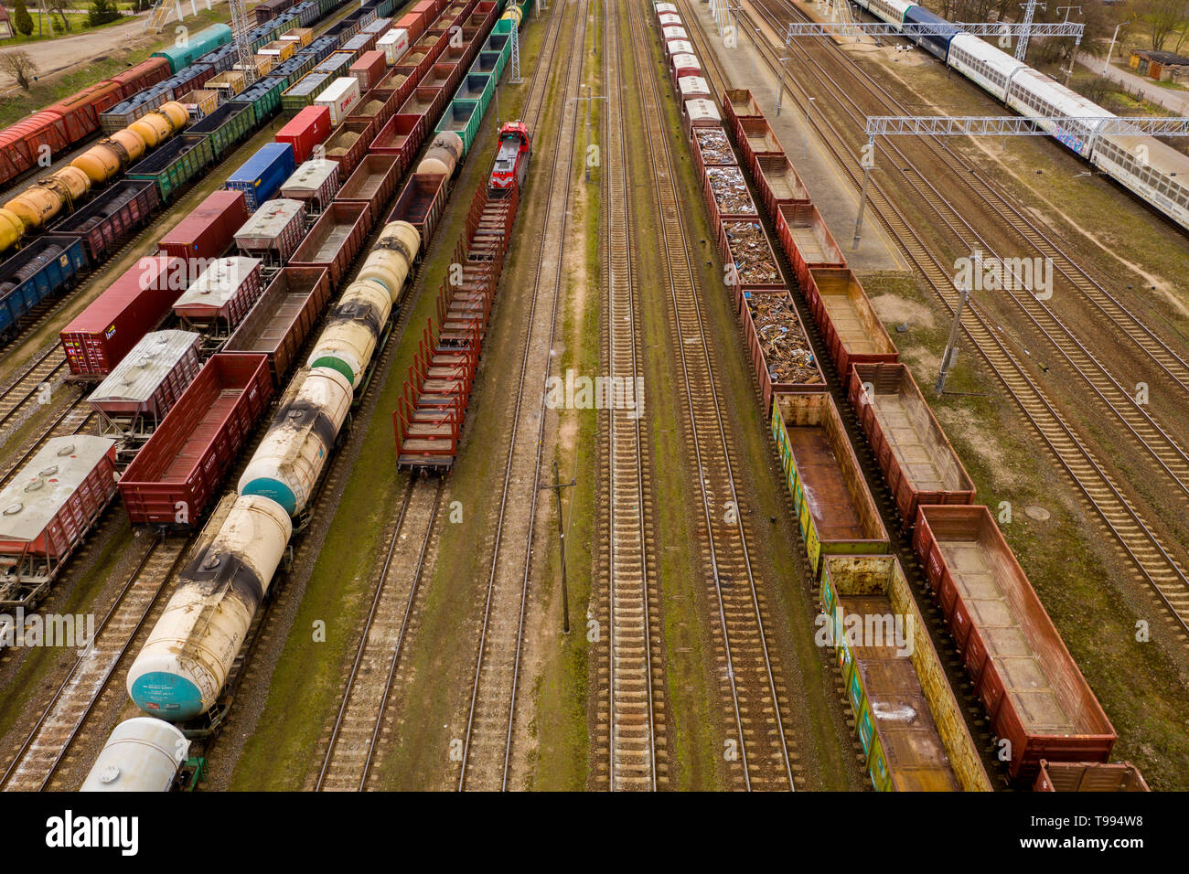 Aerial view of colorful freight trains with goods on the railway ...