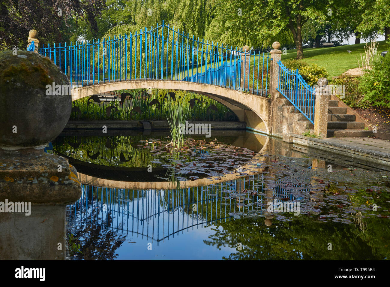Blue bridge over Abbey Park lake in Evesham, England, United Kingdom ...