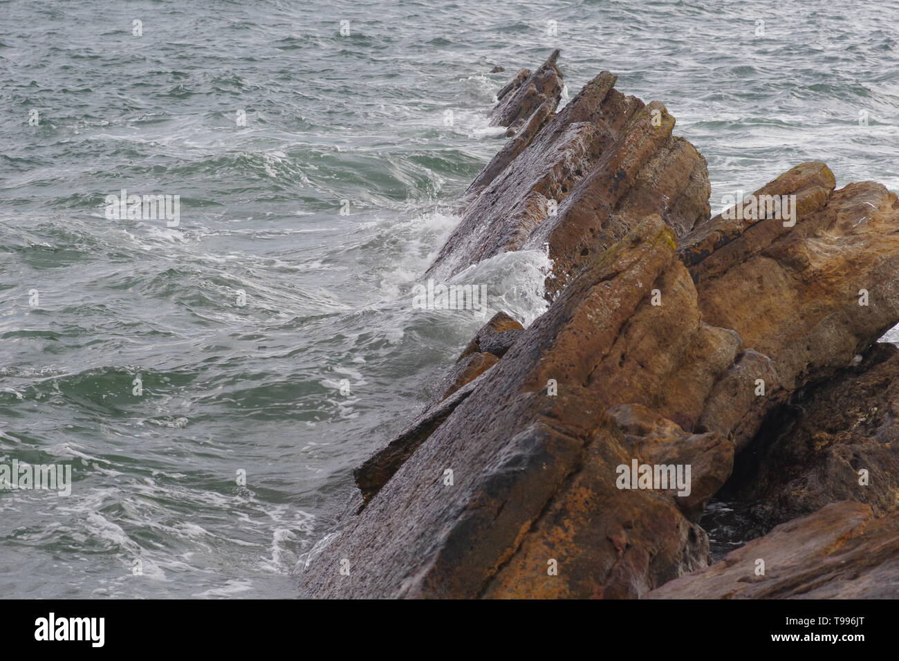 Rugged Dipping Carboniferous Sandstone Bed, affected by Conjugate ...