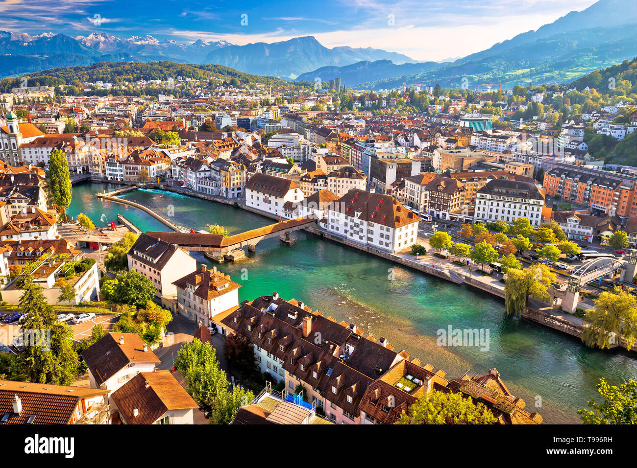 City of Luzern riverfront and rooftops aerial view, Alps landscape of ...
