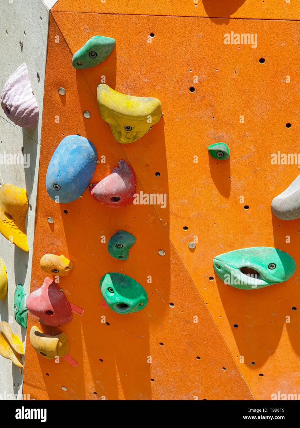Indoor and outdoor sports climbing stone wall Stock Photo - Alamy