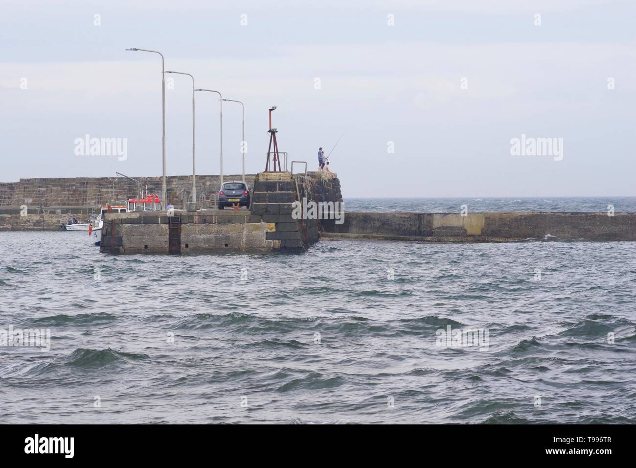 Anglers Sea fishing from the Harbour Wall at St Monans, Fife, Scotland ...