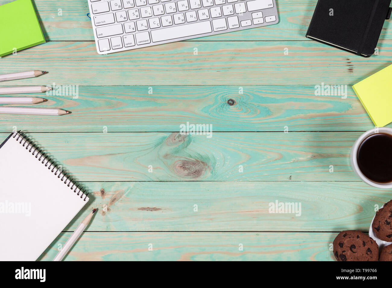 Blue office desk table with with office supplies. Top view with copy ...