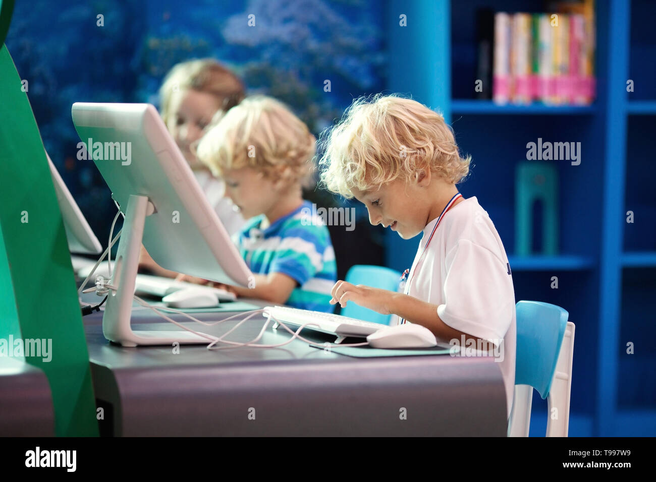 Kids with computer. Children learning and studying information and ...