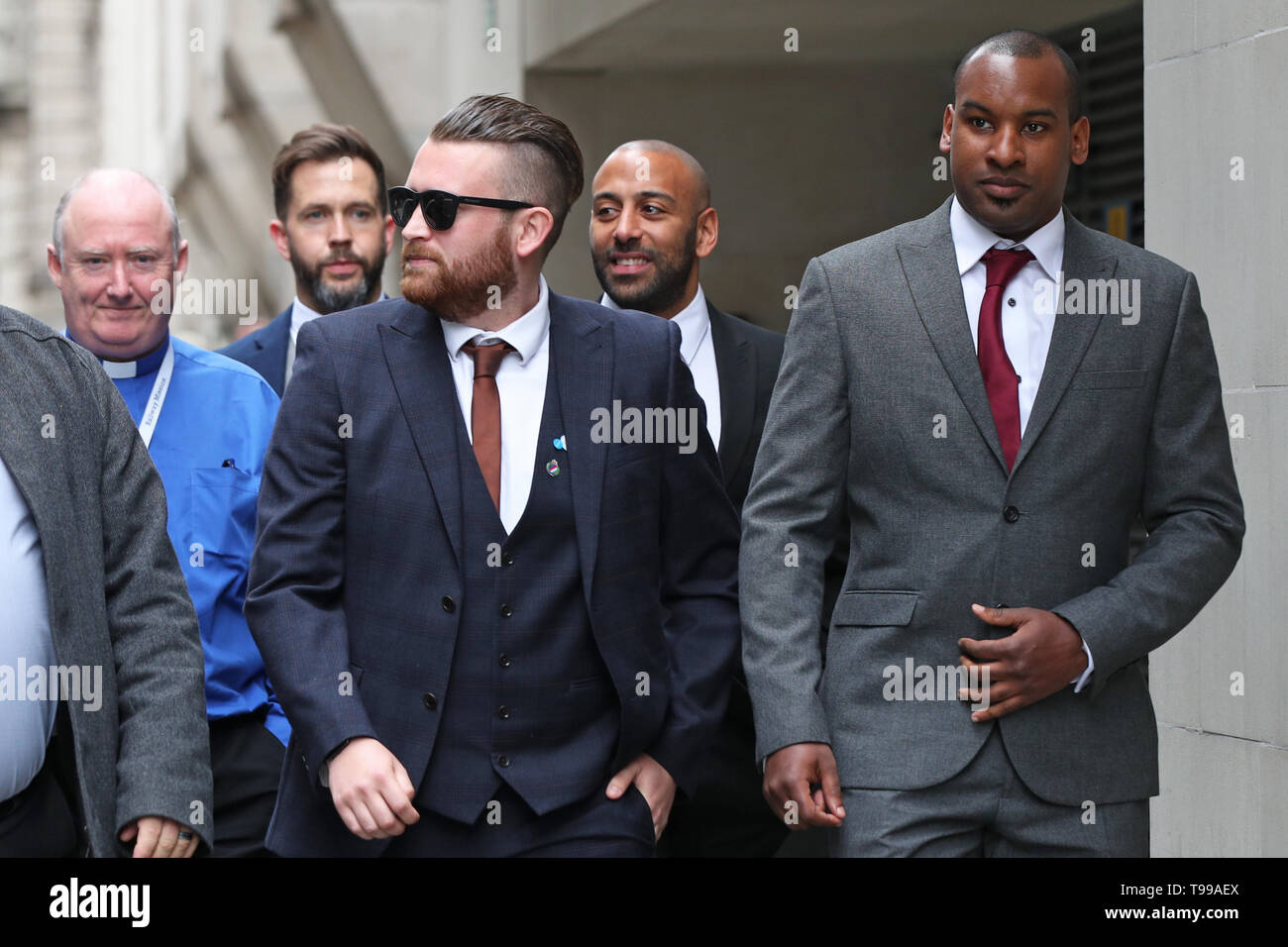 Pc Charlie Guenigault (third left), Pc Leon McLeod (second right) and ...