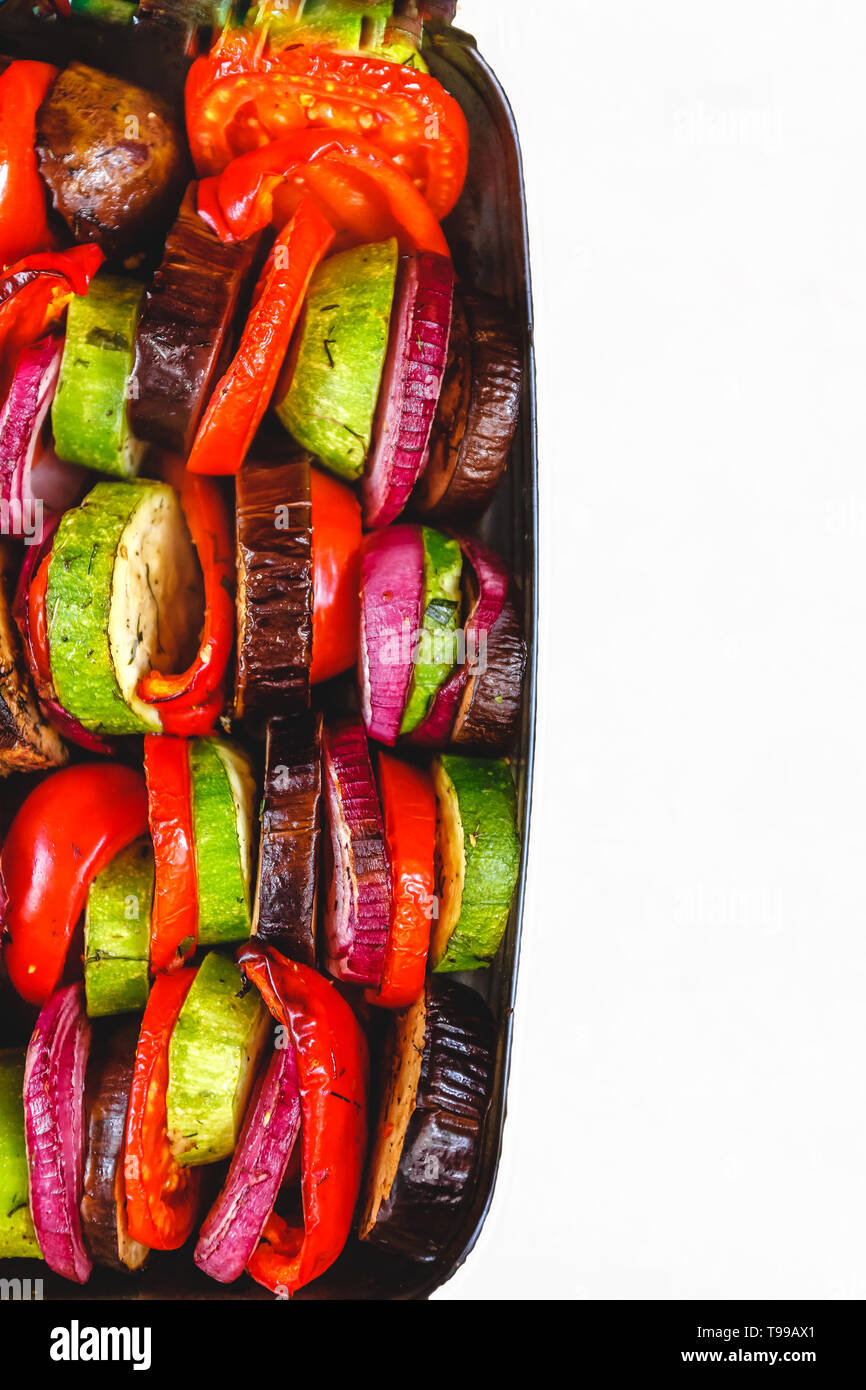 Assorted different bright and juicy baked vegetables, zucchini ...