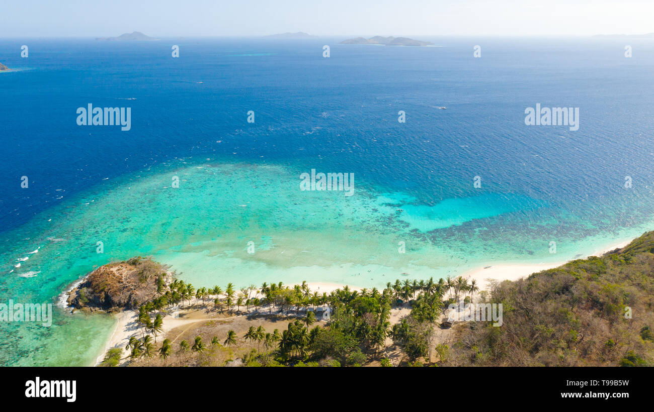 aerial seascape tourists enjoy the tropical beach. tropical island with ...