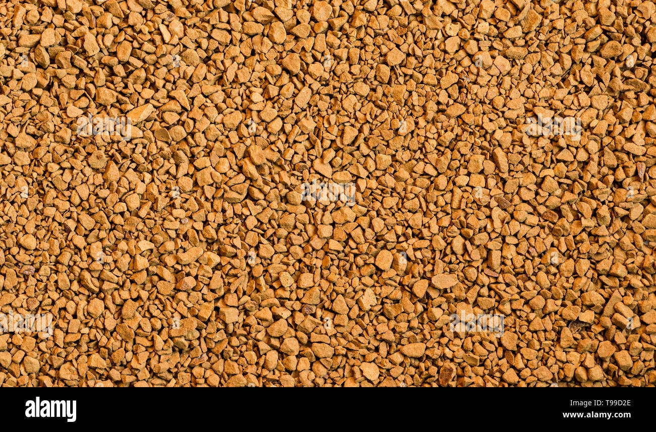 Instant coffee granules, background Stock Photo - Alamy