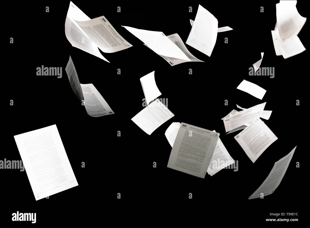 Many flying business documents isolated on black background. Papers ...