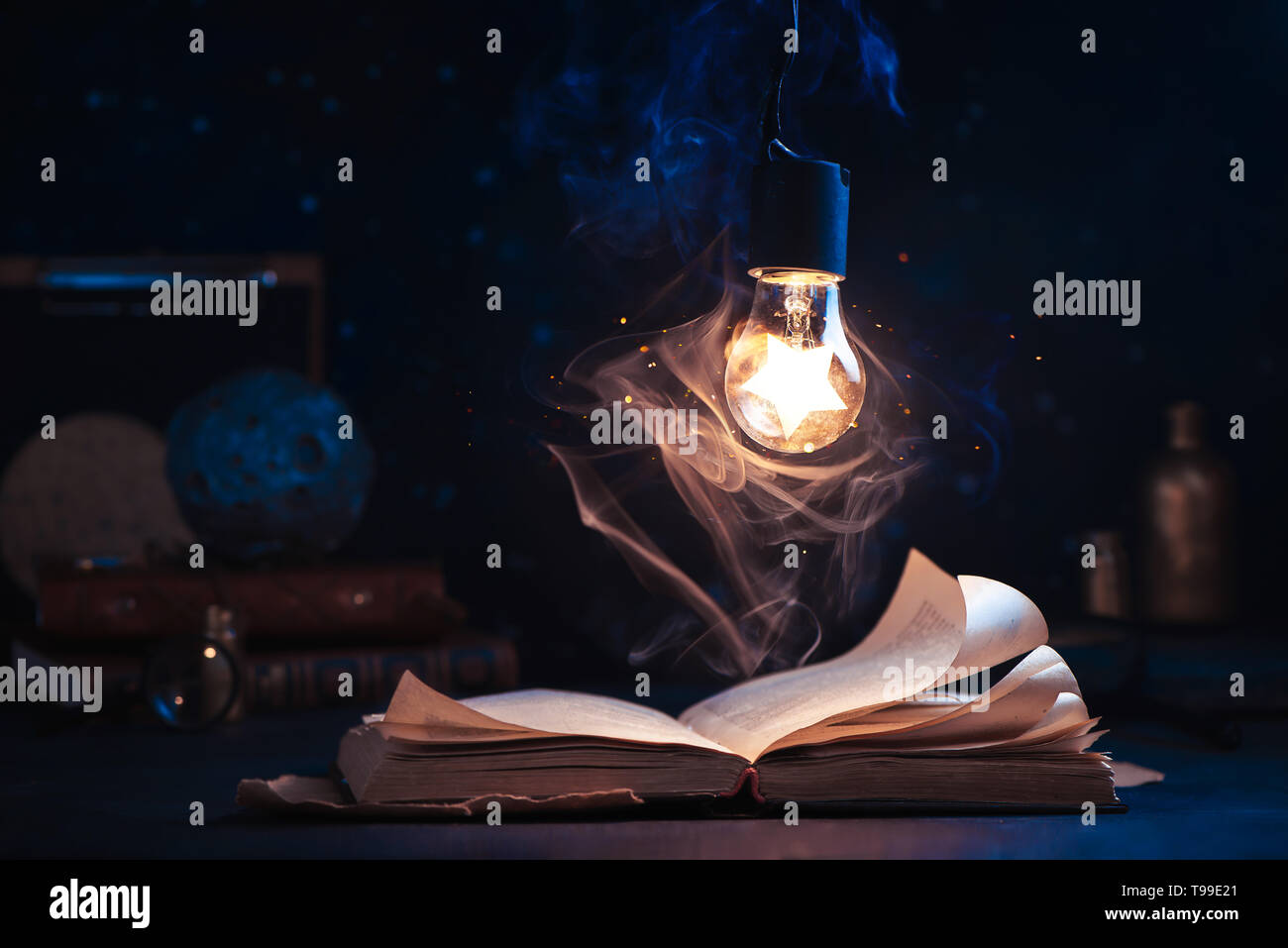 An open book with lighting by a star inside a lightbulb. Night reading ...