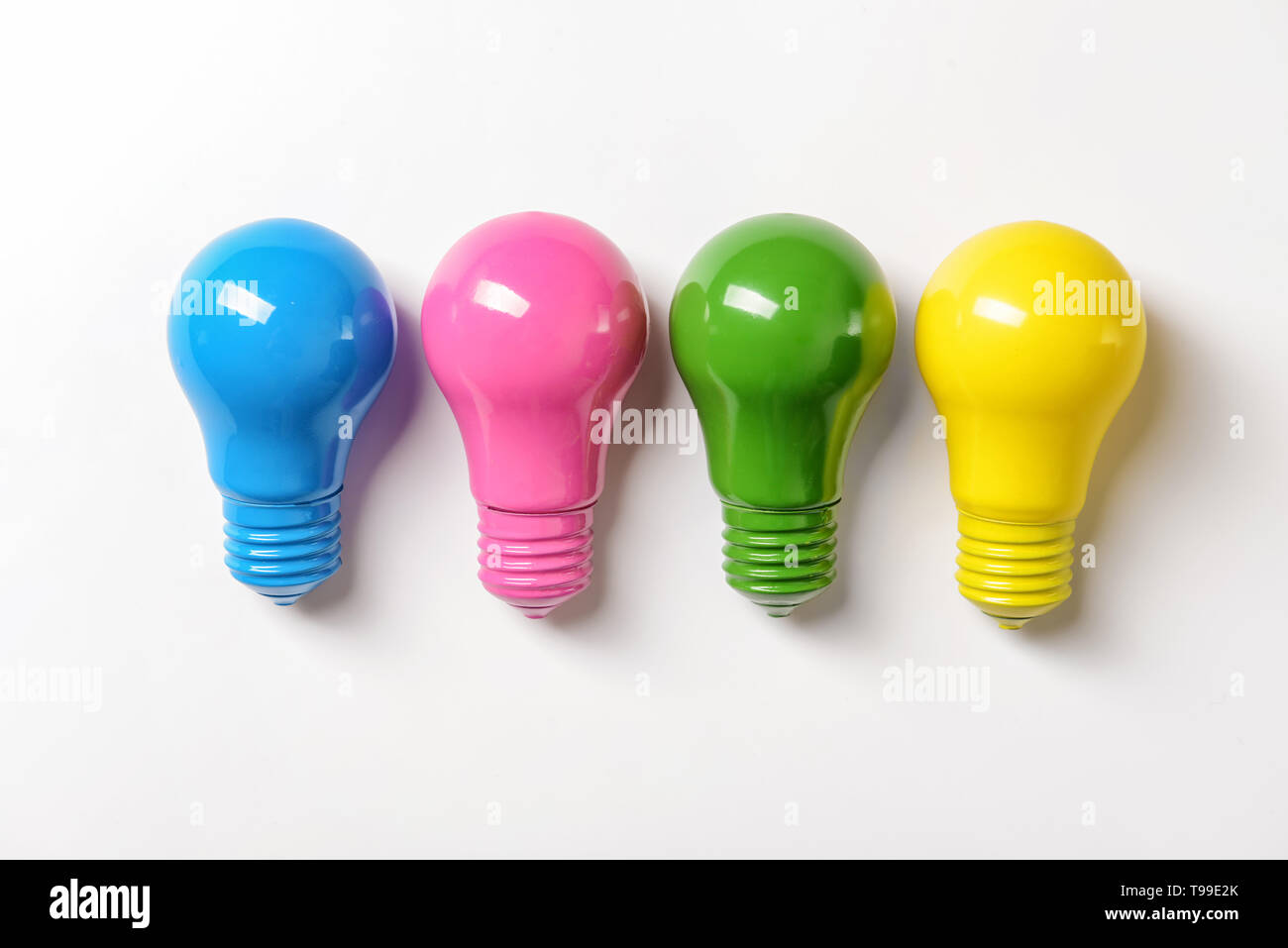 Colorful light bulbs on white background Stock Photo - Alamy