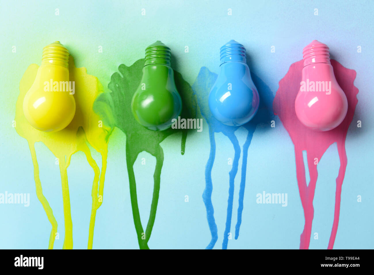 Painted light bulbs with streaks on color background Stock Photo - Alamy