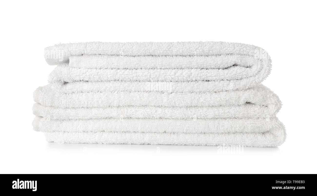 Stack of clean soft towels on white background Stock Photo - Alamy