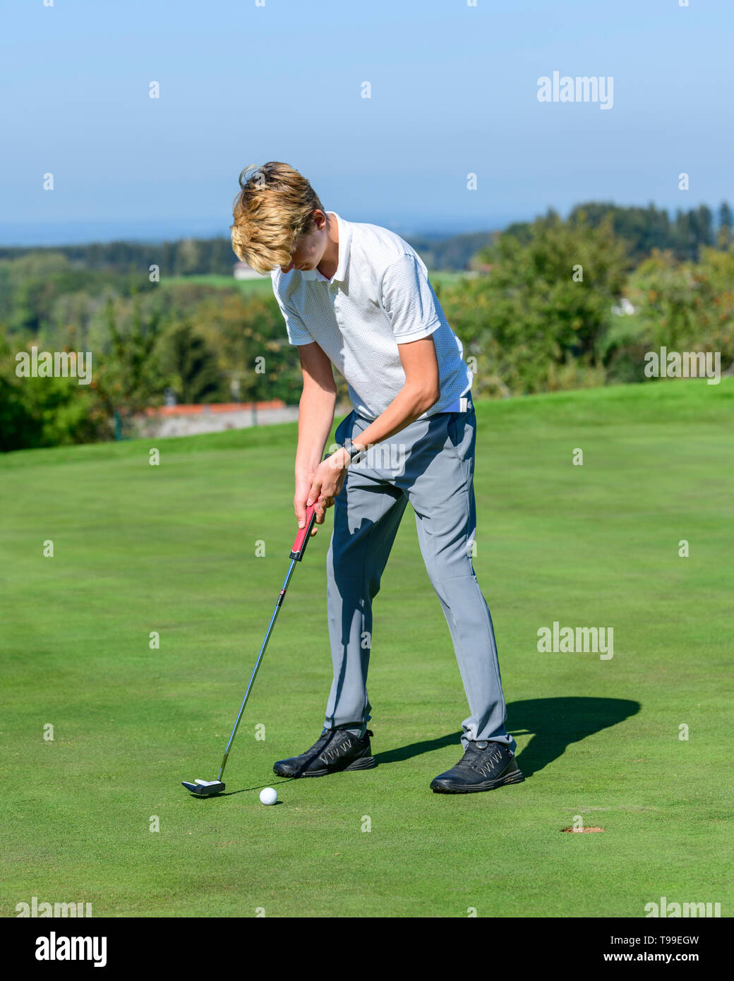 Teenager golf hi-res stock photography and images - Alamy
