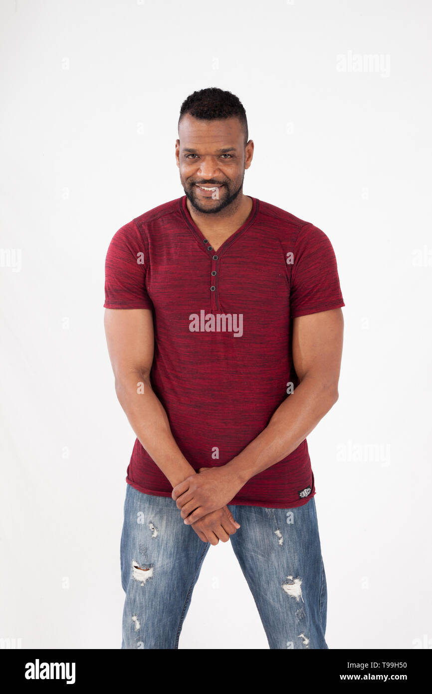 Happy Black man in a red shirt Stock Photo - Alamy