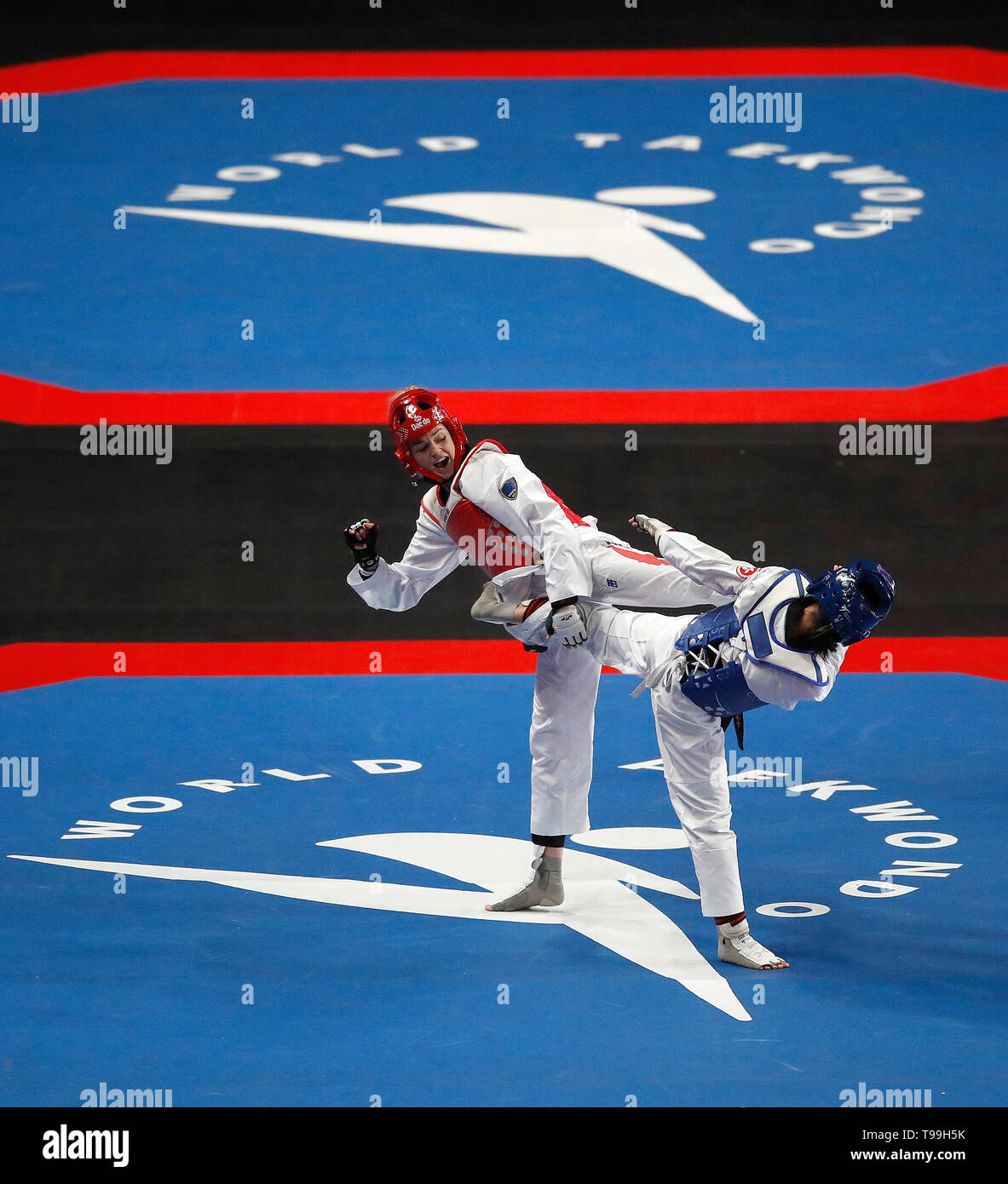 Great Britain's Maddison Moore (left) on her way to winning her Round ...