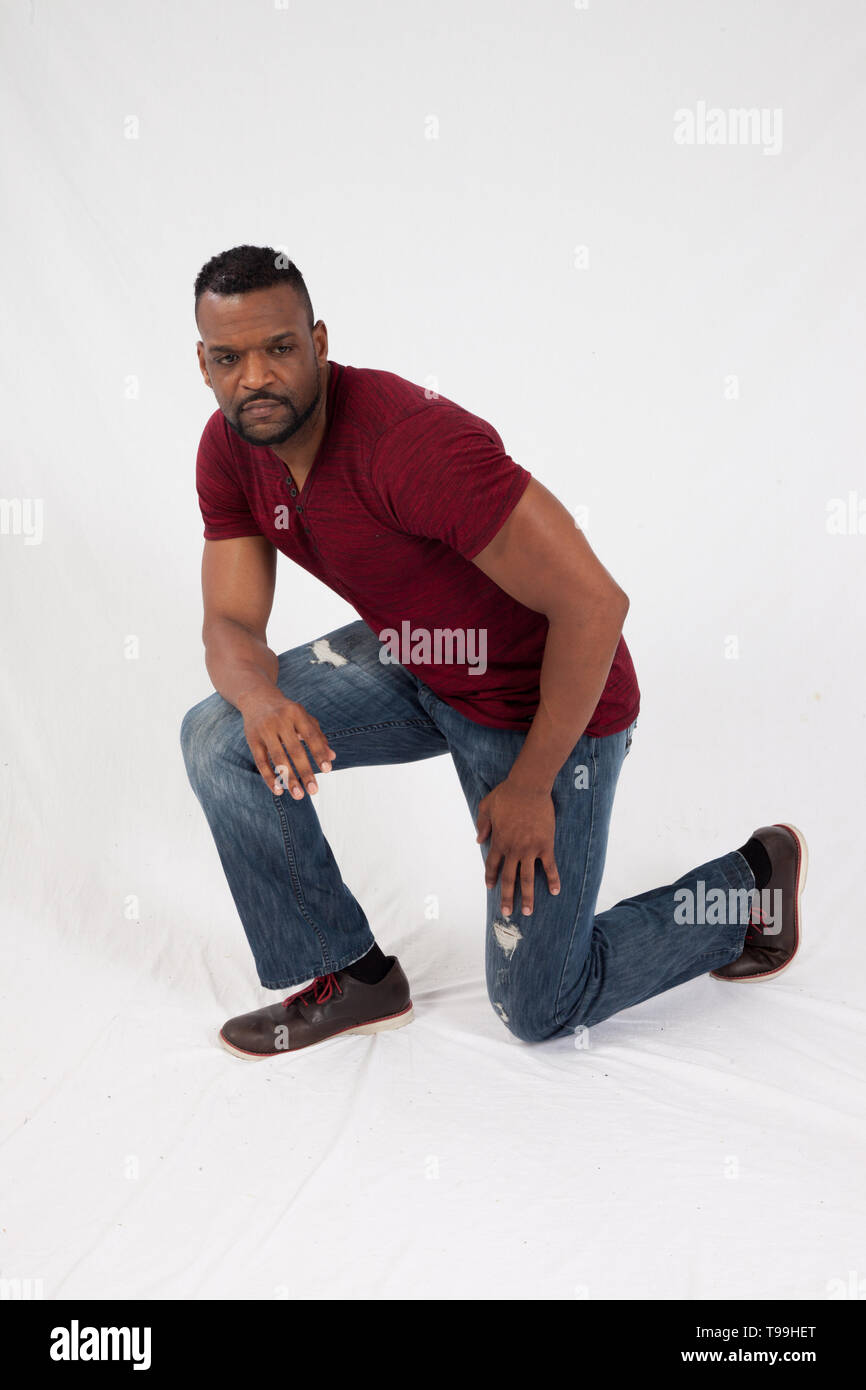 Kneeling man hi-res stock photography and images - Alamy