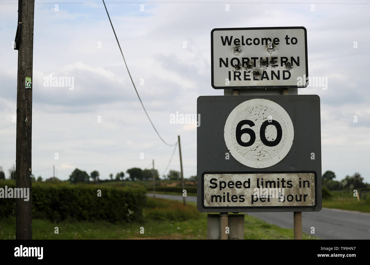 A bullet riddled welcome to Northern Ireland sign on the border between ...