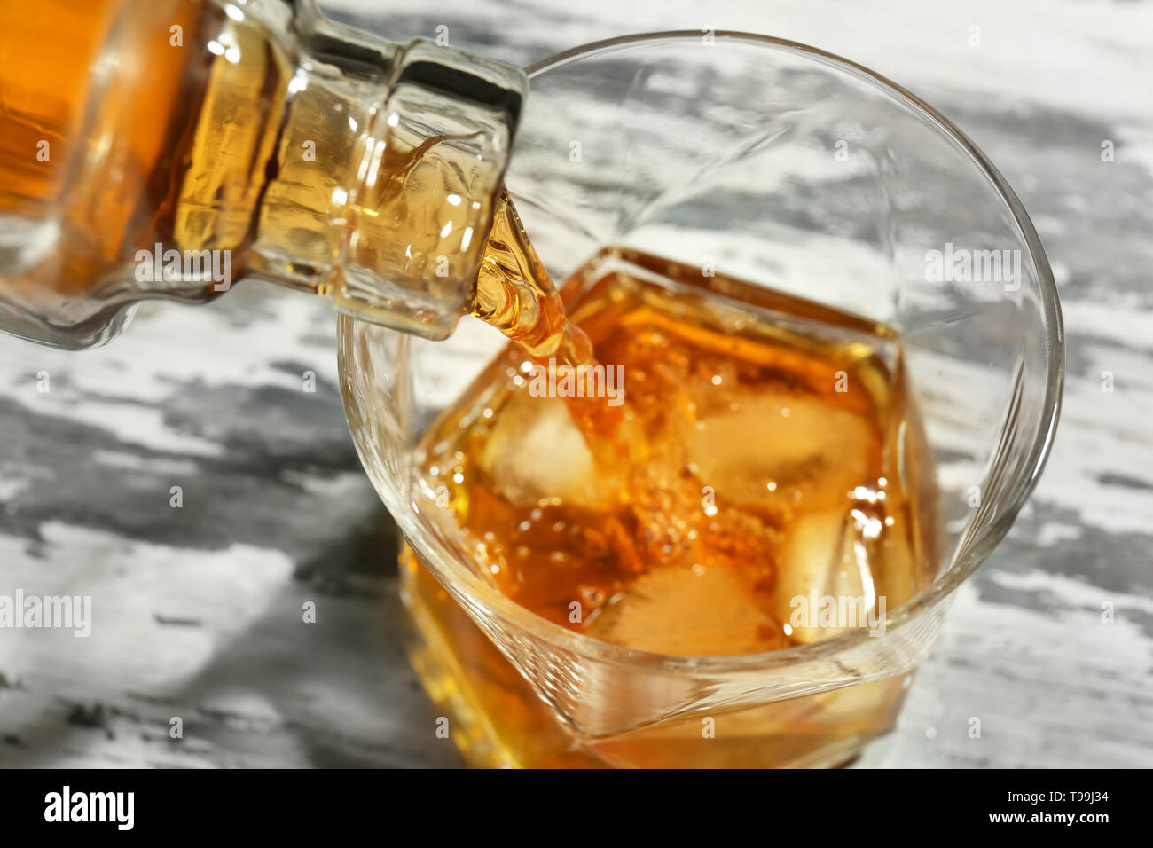 Pouring tasty whiskey from hi-res stock photography and images - Alamy