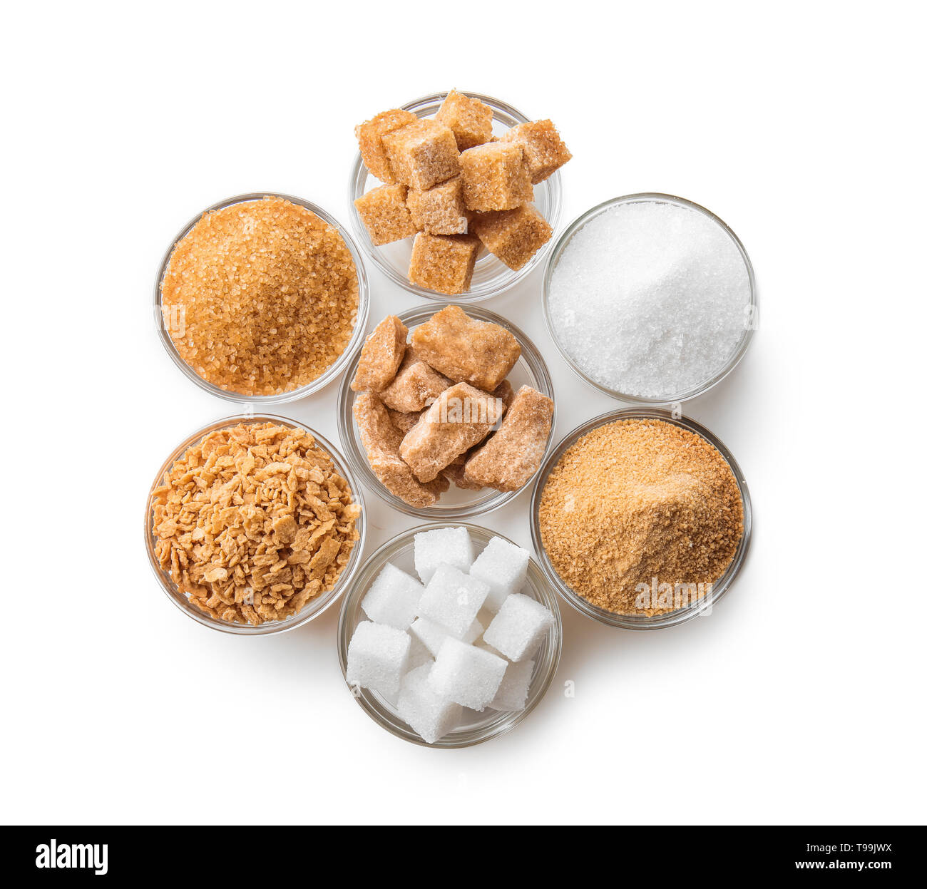 Bowls with different kinds of sugar on white background Stock Photo - Alamy