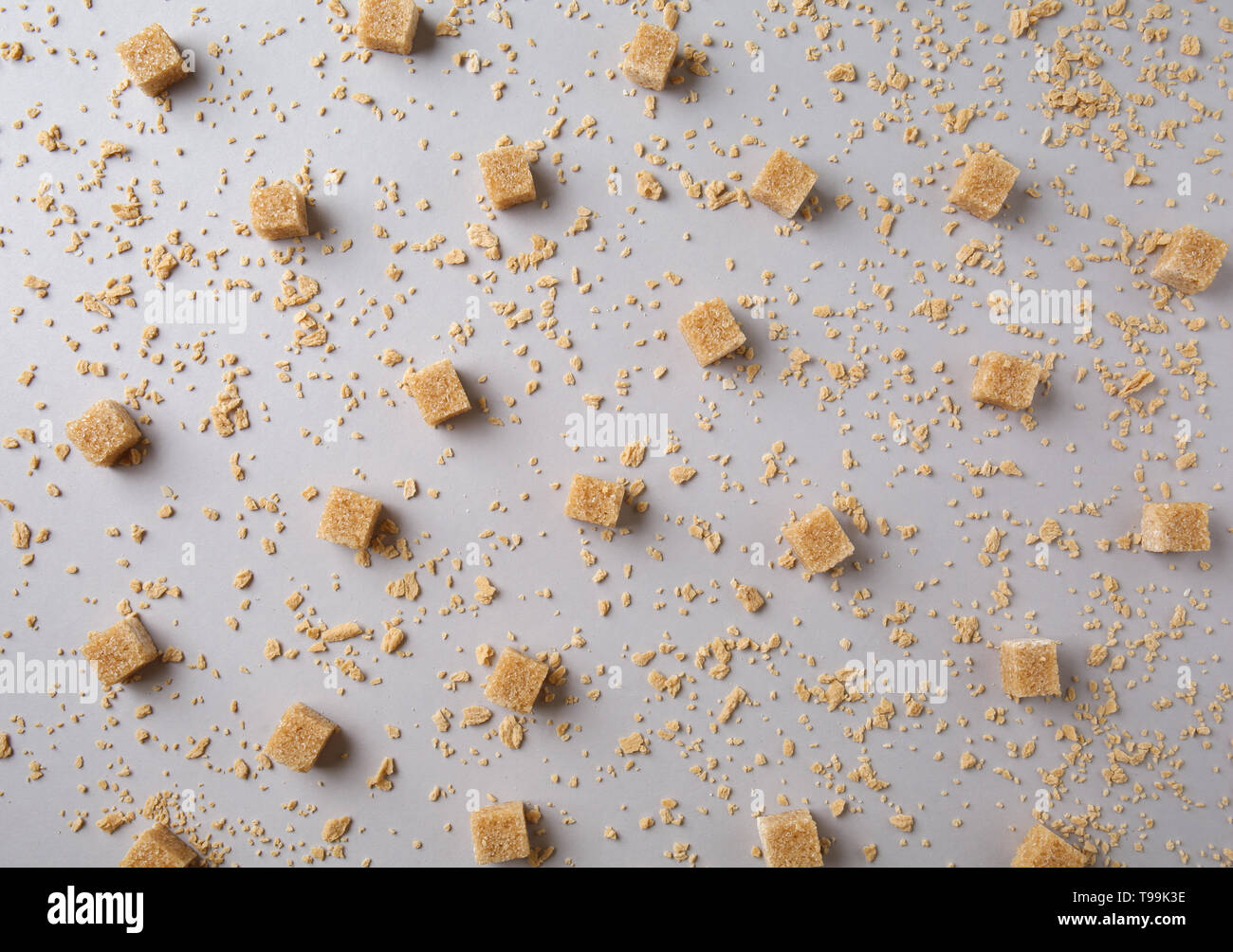 Brown cubes with maple sugar flakes on grey background Stock Photo - Alamy