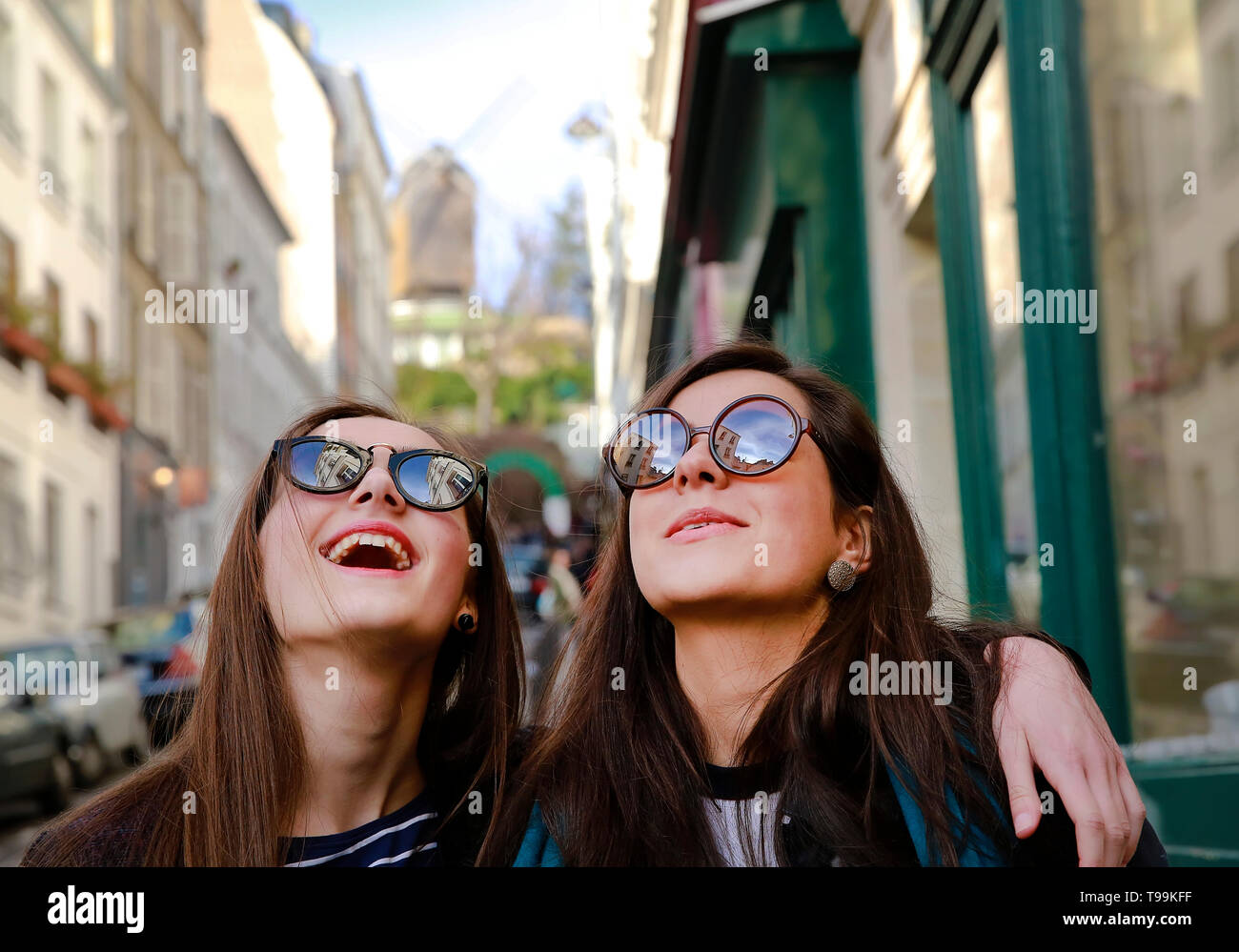Happy beautiful student girls in Paris on the street Stock Photo - Alamy