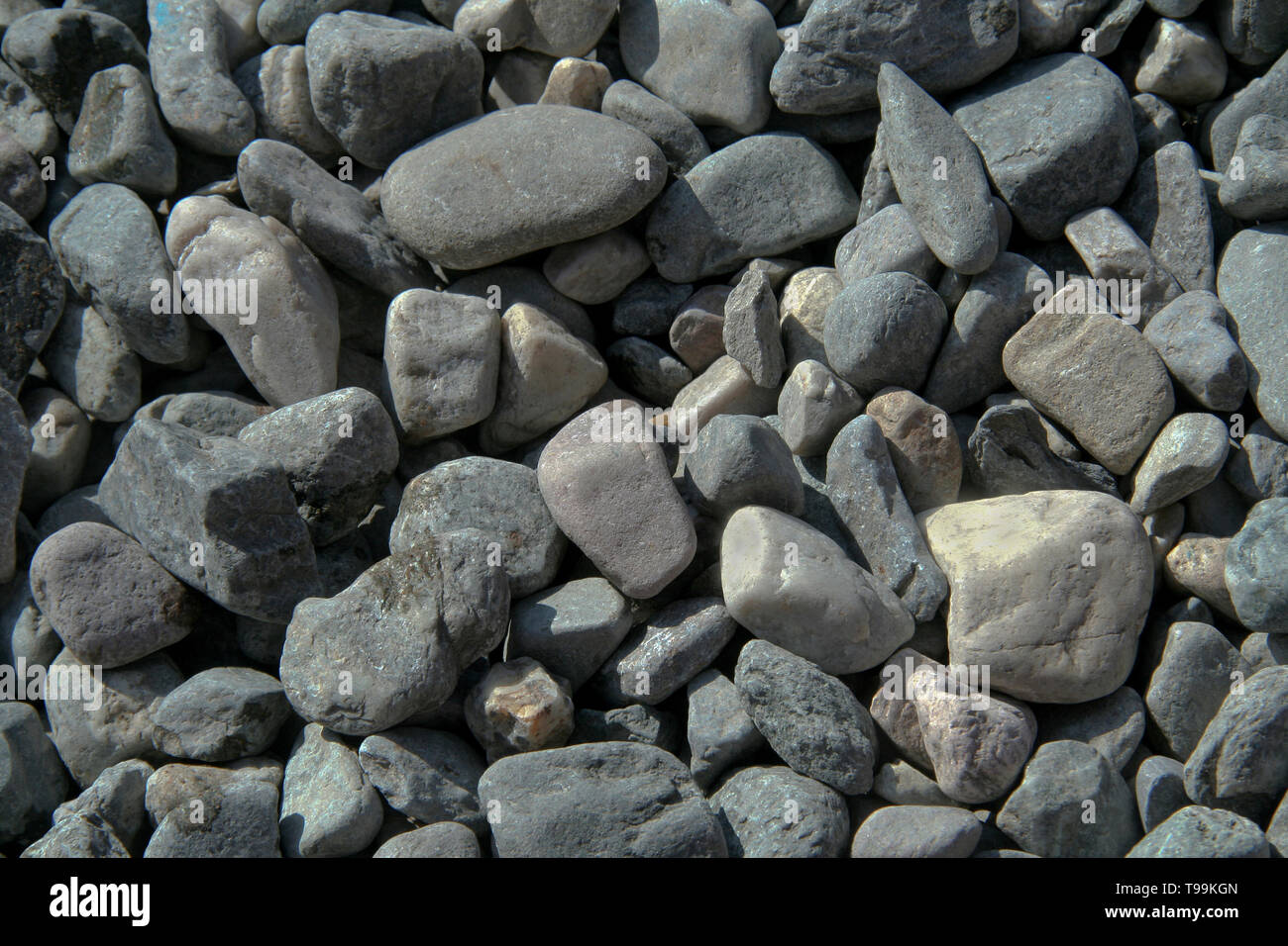 Pattern of round and smooth edged grey stones Stock Photo - Alamy